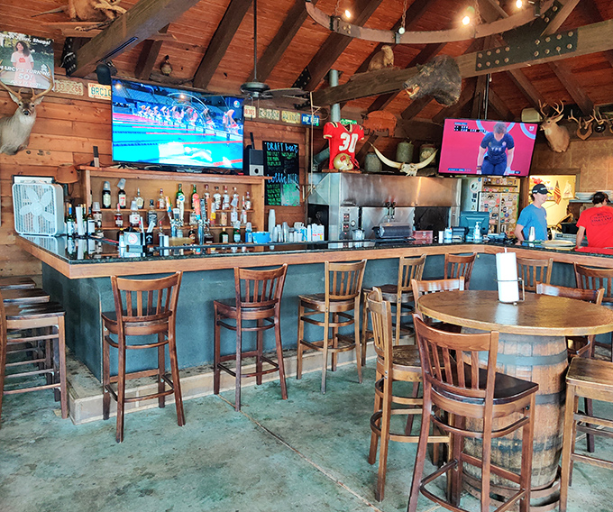 The bar area feels like the kind of place where fishing stories get better with each round – mounted trophies silently judging the exaggerations.