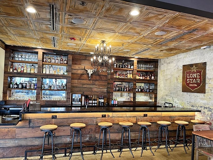 The bar area combines rustic Texas charm with urban sophistication—proof that barbecue and craft cocktails are a match made in Houston heaven.