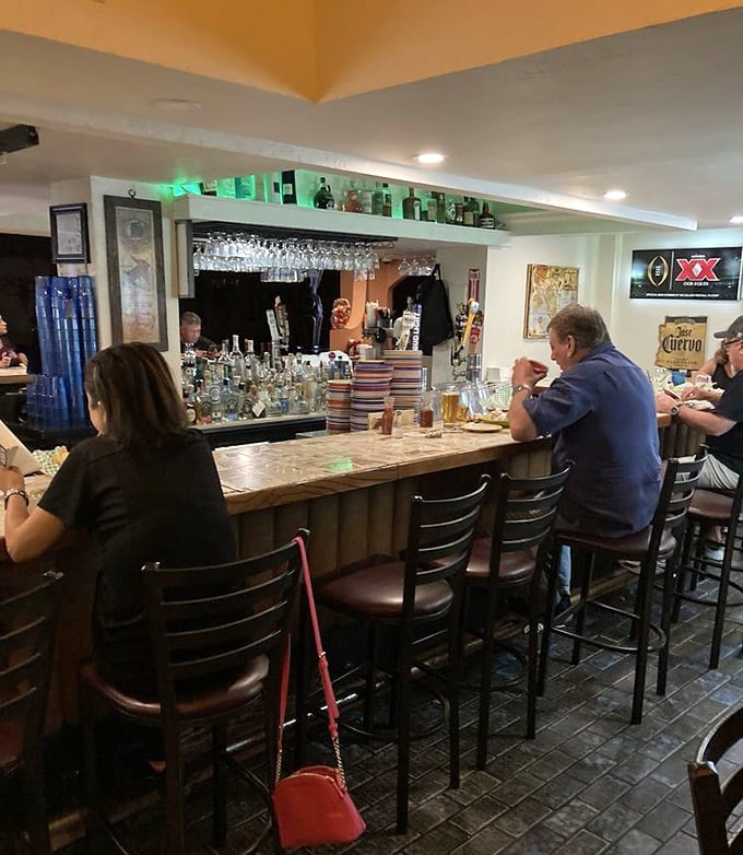 The bar isn't just serving drinks; it's dispensing liquid courage for that second round of spicy salsa.