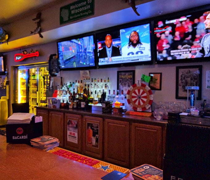 A bar setup that says "pull up a stool and tell me your troubles." The "Welcome to Wisconsin" sign isn't just decoration – it's a promise.