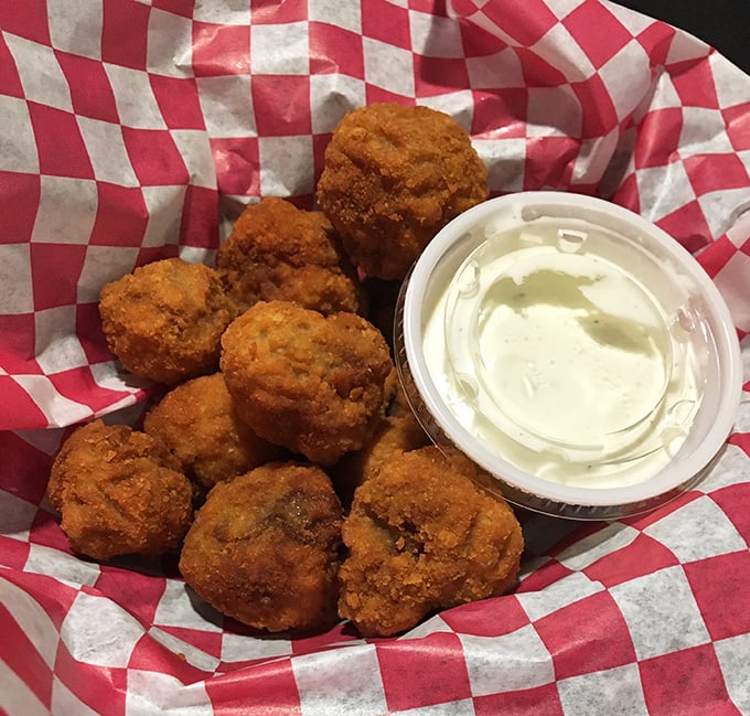 These golden-brown mushrooms, like little flavor bombs waiting to explode, prove that even the sides at Sneaky's deserve the spotlight.