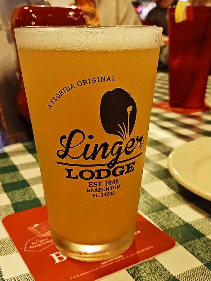Cold beer in a classic glass – the perfect companion for swamp cuisine. Nothing cuts through gator tail batter like a crisp, golden Florida brew.