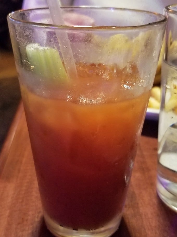 This isn't just a Bloody Mary—it's breakfast, entertainment, and liquid courage all in one convenient glass. The celery straw is just showing off.
