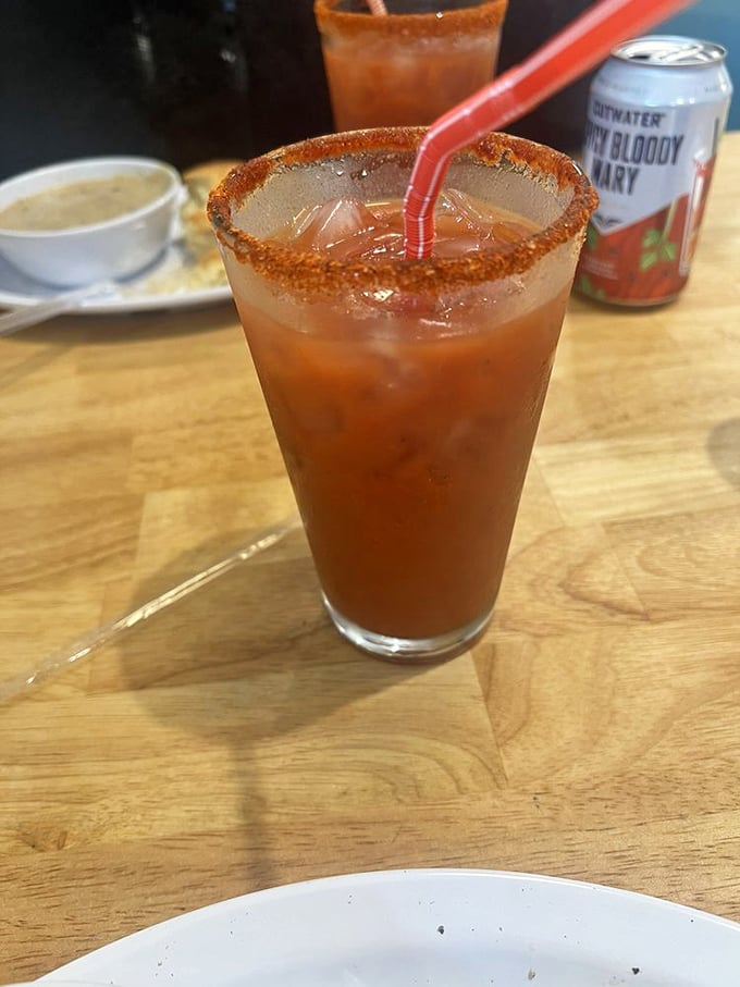 This isn't just a Bloody Mary—it's breakfast, appetizer, and cocktail in one glass. That spiced rim isn't decoration; it's the first act of a flavor journey.