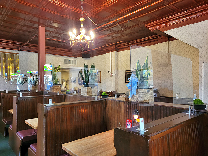 Wooden booths polished by decades of elbows and conversations—each one a private dining room with a side of nostalgia.