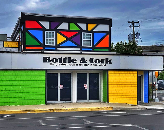The Bottle & Cork's colorful facade announces "fun lives here" louder than any neon sign ever could.