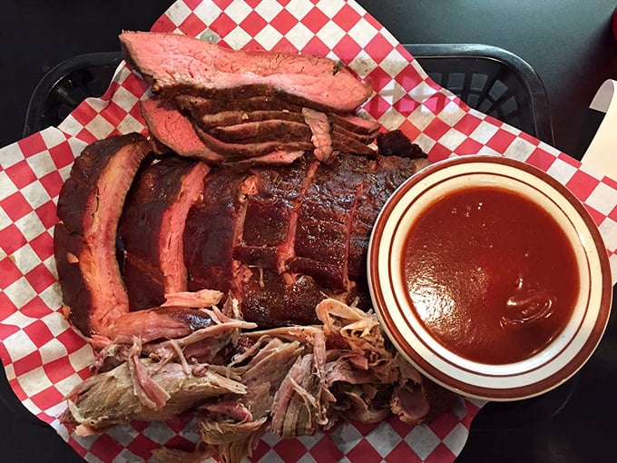 Brisket sliced to perfection with a side of pulled pork. That smoke ring is the barbecue equivalent of Olympic gold.