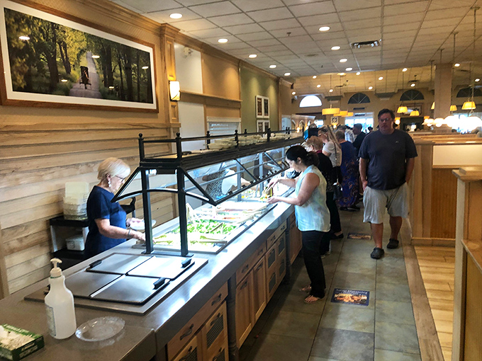 The buffet line—where dreams and diets go to negotiate terms. Fresh, abundant, and constantly replenished, just like your plate will be.