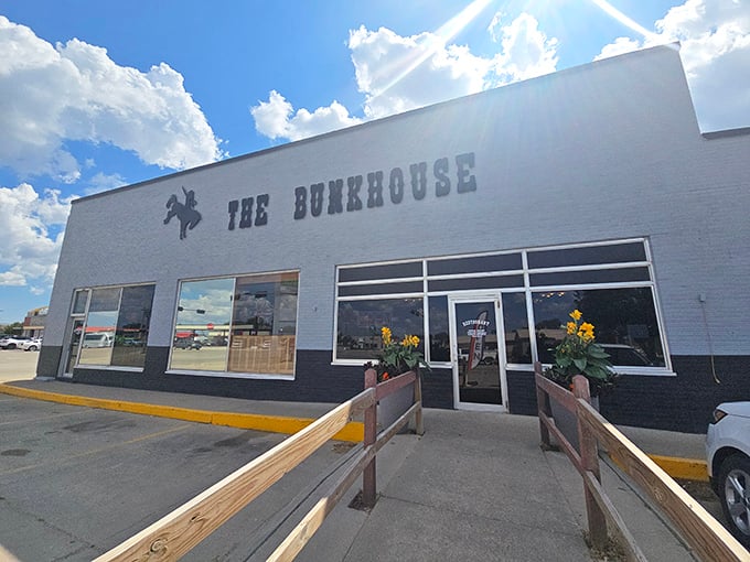 The Bunkhouse welcomes visitors with a classic Western silhouette and sunflowers that seem to nod "howdy" as you approach.