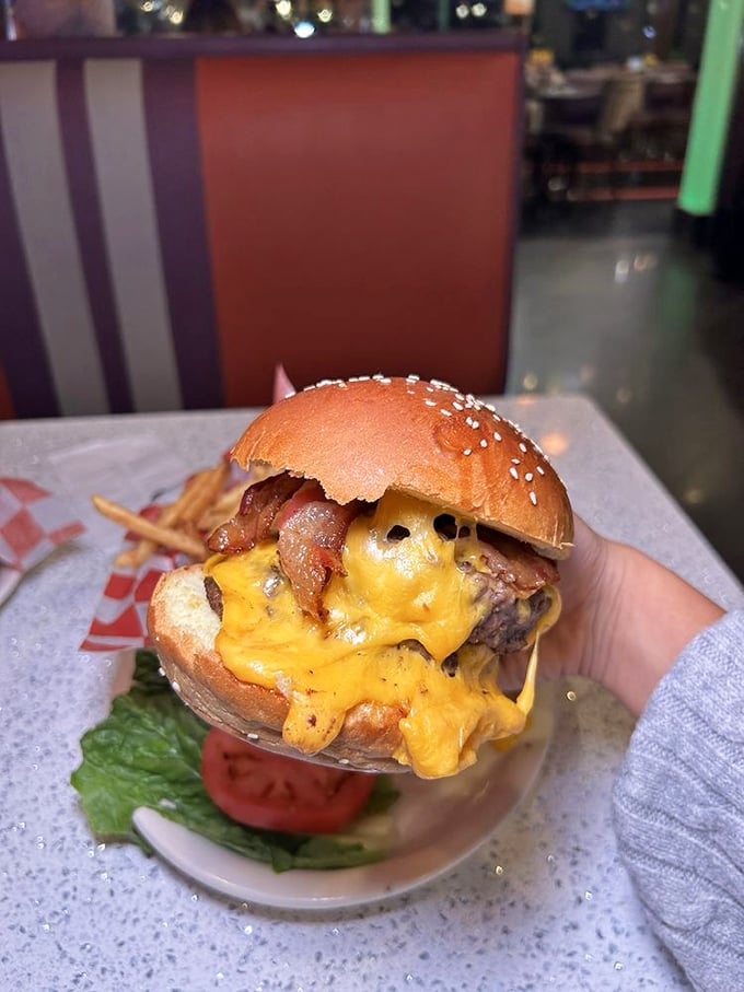 The burger that launched a thousand cravings—melted cheese cascading down like a yellow waterfall of happiness.