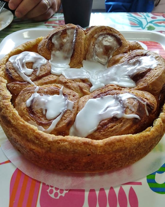 This cinnamon butter ring isn't just breakfast—it's an event. The perfect spiral suggests the baker might have been a mathematician in another life.