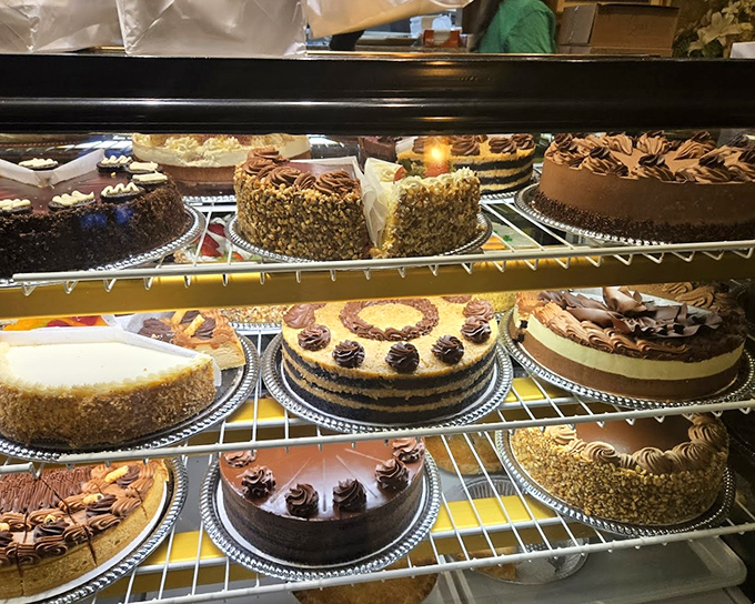 The dessert case—where willpower goes to die and "I'll just have a bite" becomes the lie we tell ourselves.