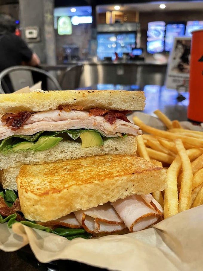 This isn't just a turkey sandwich—it's architectural perfection with layers of avocado, bacon, and turkey creating the skyscraper of sandwiches your lunch hour deserves.