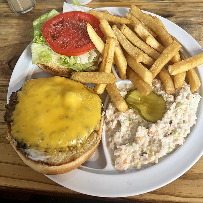 A cheeseburger plate that proves the best things in life don't need filters—just fresh ingredients, proper cooking, and a side of nostalgia.