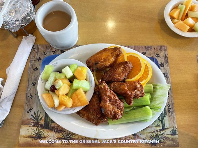Chicken wings with celery and fresh fruit—proof that Jack's knows how to do lunch just as brilliantly as breakfast.