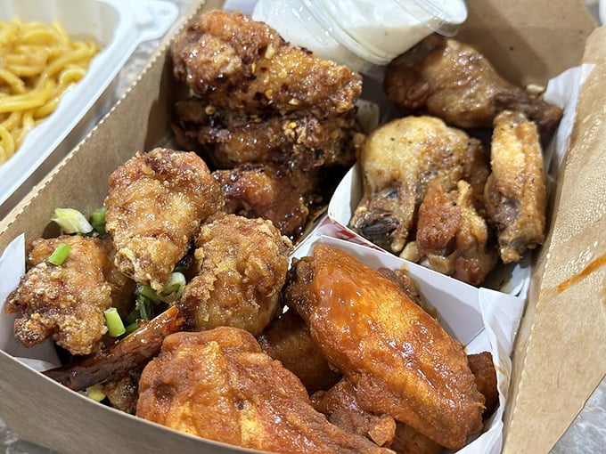 Crispy, golden chicken wings nestled in their takeout container – because sometimes even seafood lovers need a brief detour into poultry paradise.