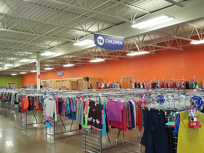 The children's section explodes with color, where tiny fashions await growth spurts that parents know will come all too quickly.