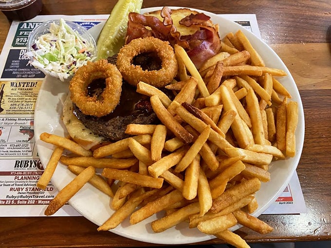 This burger doesn't just come with onion rings—it wears them like jewelry. The kind of magnificent excess that makes diners America's culinary happy place.