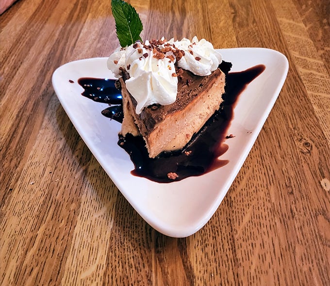 This chocolate peanut butter pie doesn't just satisfy your sweet tooth—it writes it love poetry. The whipped cream crown makes it dessert royalty.