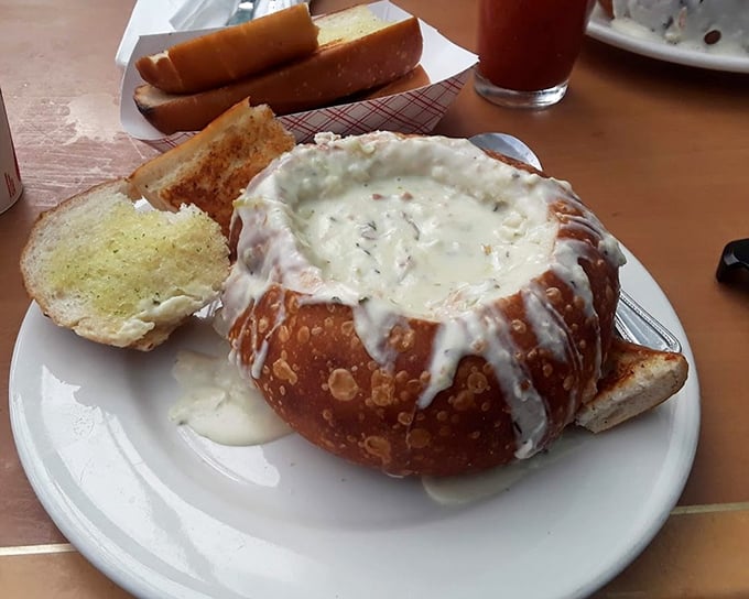 Clam chowder served in a sourdough bread bowl—the ultimate edible dishware innovation. When you finish the soup, the real fun begins.