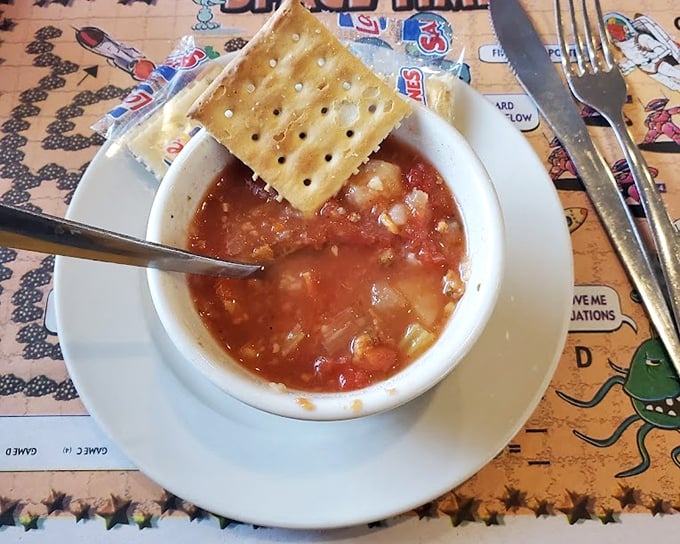 This bowl of clam chowder isn't just soup—it's a warm hug in liquid form, with a saltine cracker hat for good measure.