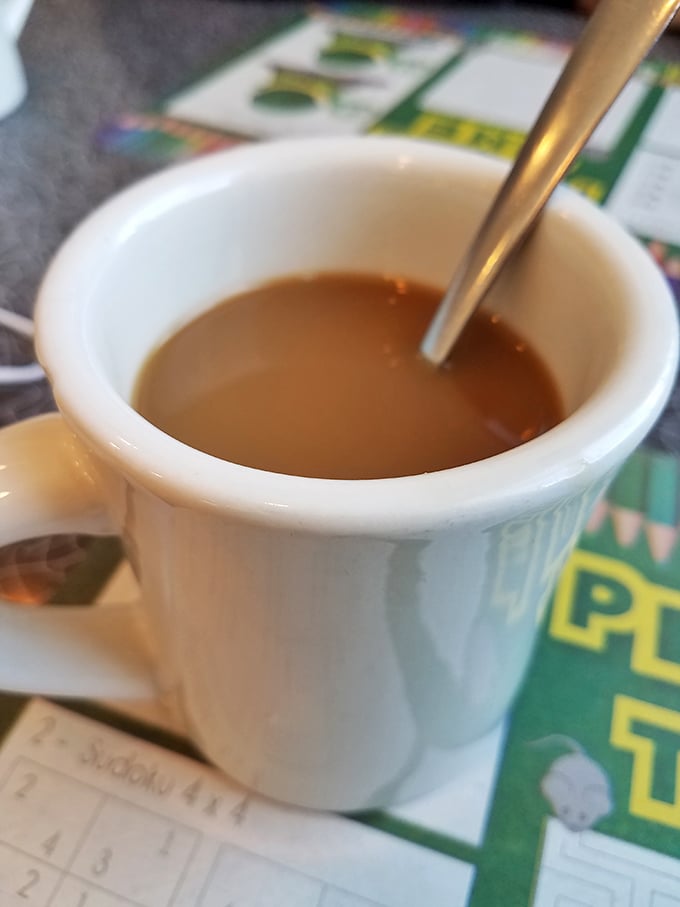 The humble coffee mug—unsung hero of American diners. This isn't artisanal pour-over in a ceramic vessel; it's liquid fuel for real conversation.