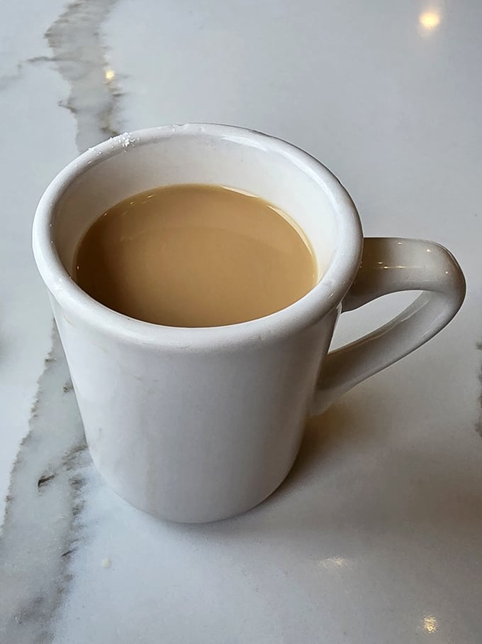 The humble diner coffee mug—holding the elixir that transforms morning zombies into functioning humans since forever.
