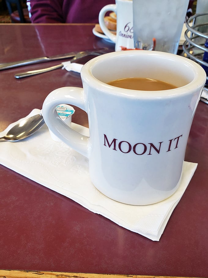 MOON IT says the mug, and I'm ready to obey. There's something deeply reassuring about diner coffee that fancy espresso bars just can't replicate.