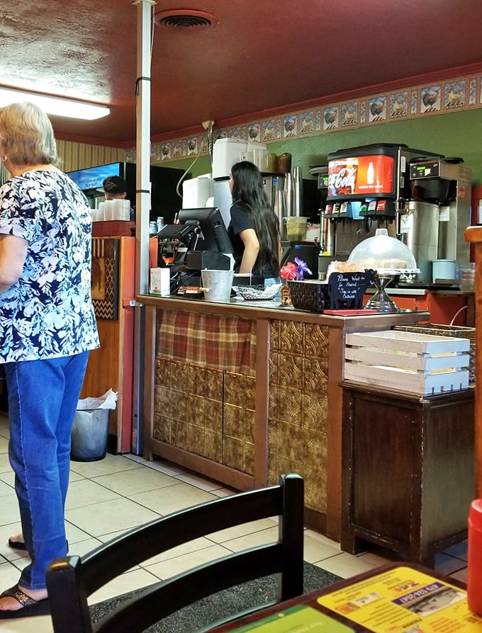 The counter area—where coffee flows freely and the staff remembers your order before you've fully settled into your seat.