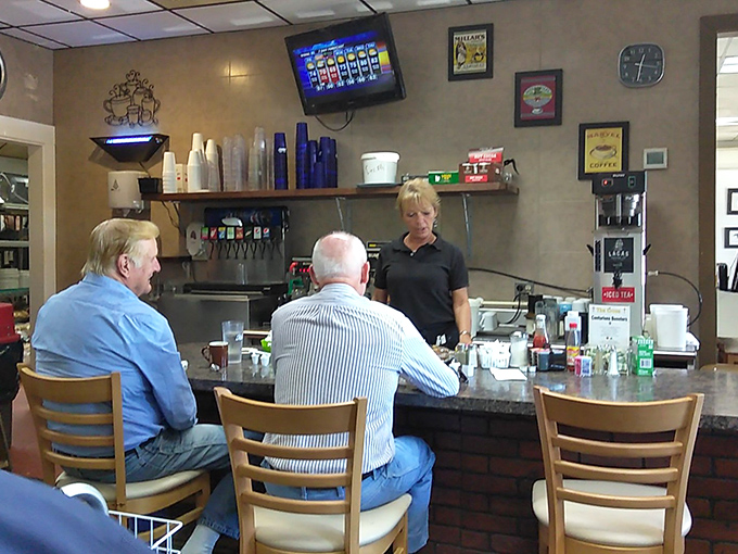 The counter – where regulars perch like breakfast philosophers, discussing world events over bottomless coffee and hometown gossip.