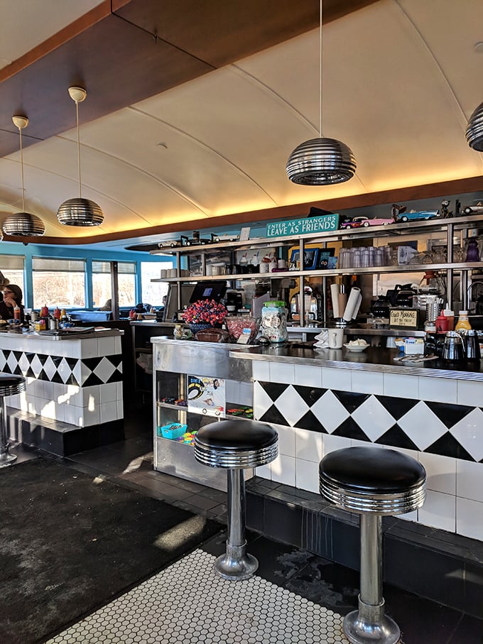 The counter where breakfast dreams come true. That black and white tile pattern isn't just decor—it's a chess board where every move ends in "delicious."