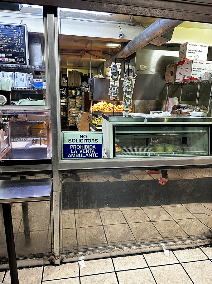 The business end of deliciousness—where orders become reality and chicken transforms from poultry to poetry through hot oil magic.