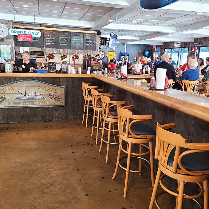The bar area – where locals swap fishing tales that grow taller with each round. Wood paneling that's witnessed countless celebrations.
