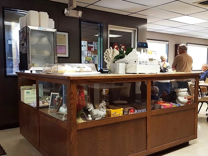 The heart of Chicken House operations – a wooden counter showcasing chicken-themed decor that tells you they're serious about their specialty.