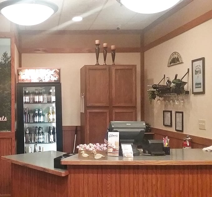 The warm wooden reception area welcomes diners with the promise of Northwest ingredients and local ownership—hospitality in physical form.