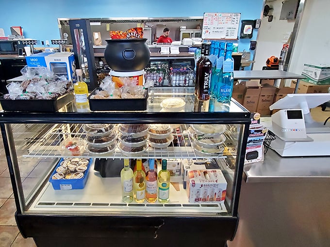The market counter offers a glimpse into seafood heaven—grab-and-go delights for those who want to create their own crab feast at home.