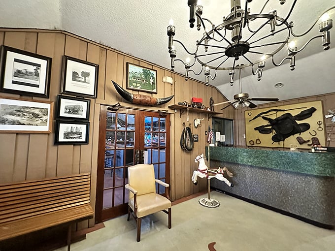 Western charm meets Florida hospitality in this wood-paneled entrance area. That longhorn on the wall isn't just decoration—it's a promise!