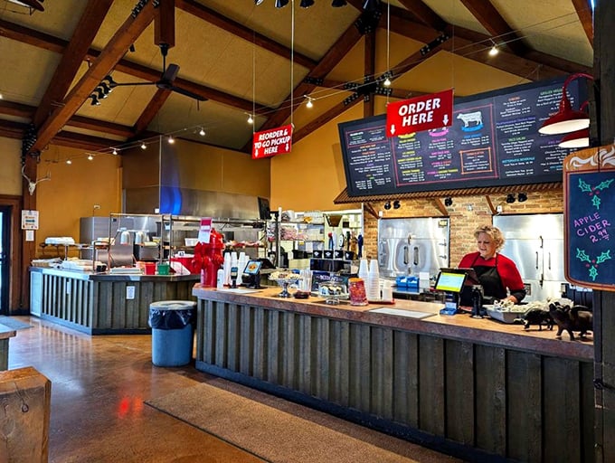 The ordering counter – where BBQ dreams begin their journey from smoker to plate with military precision and small-town friendliness.
