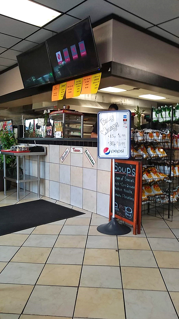 The command center where pizza dreams become reality. That whiteboard menu promises soups that comfort like a warm Pennsylvania hug.