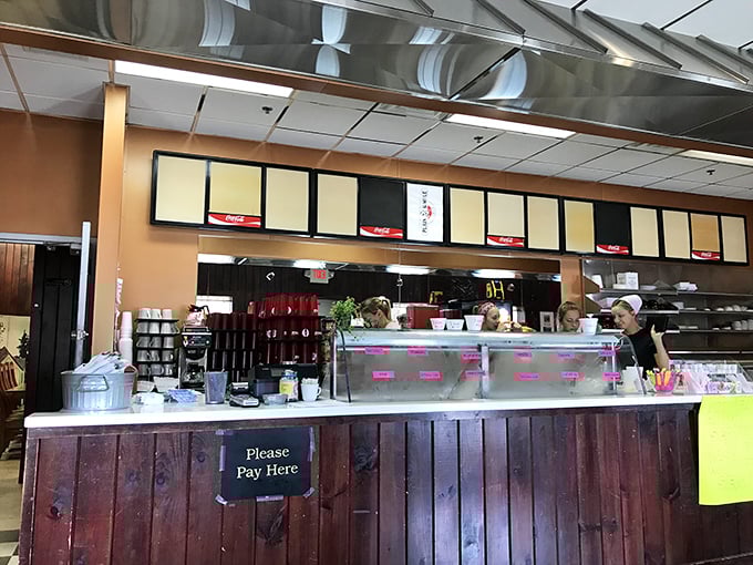 The counter where magic happens. That pie case in the background is the siren call no dessert lover can resist.