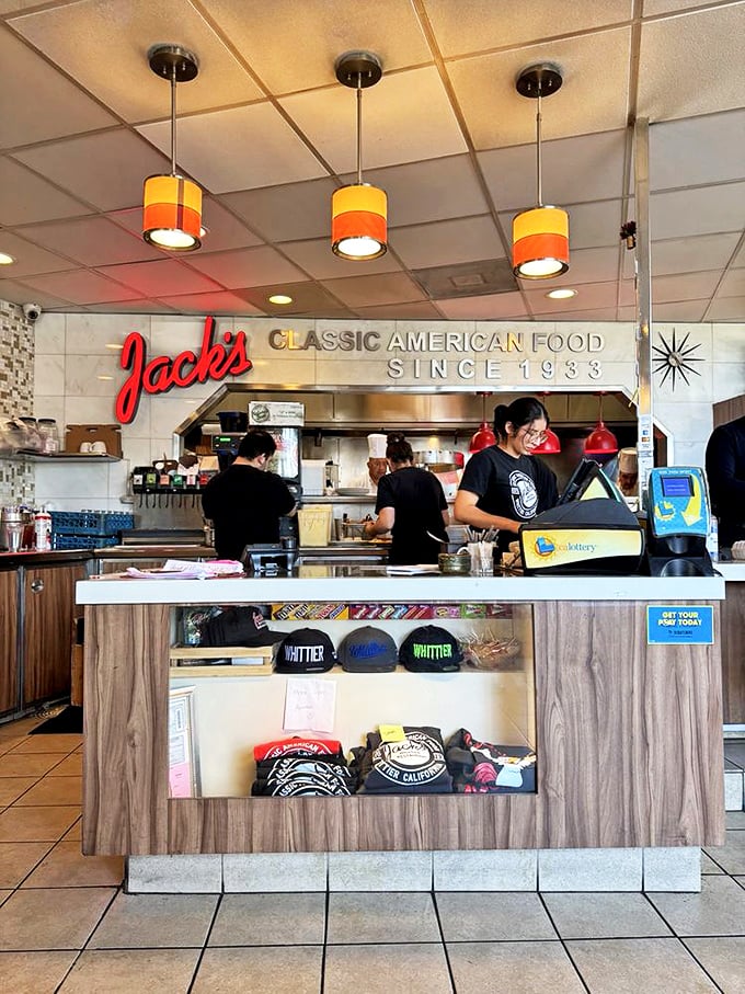 The counter where magic happens—complete with Whittier merchandise for those who want to take the experience home.