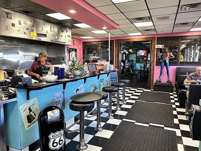 The black and white checkered floor isn't just nostalgic design—it's the universal signal that you've entered sacred diner territory.