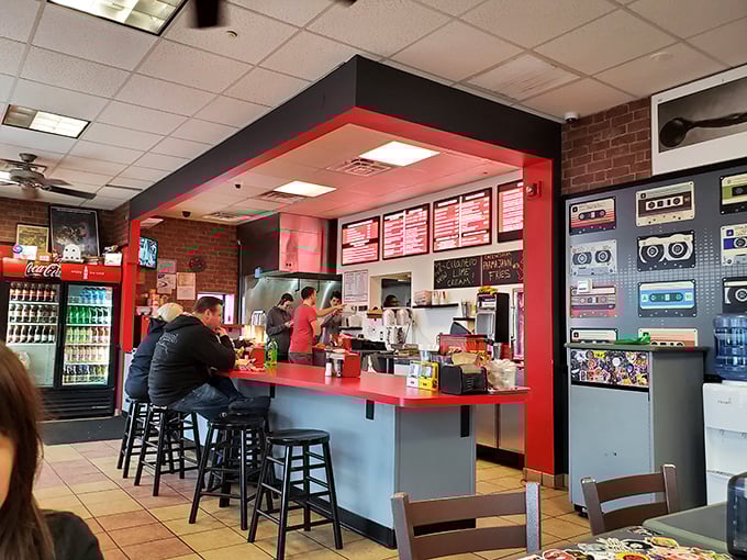 The counter isn't just where orders happen—it's where burger dreams begin. Those red menu boards aren't lists; they're promises of happiness.