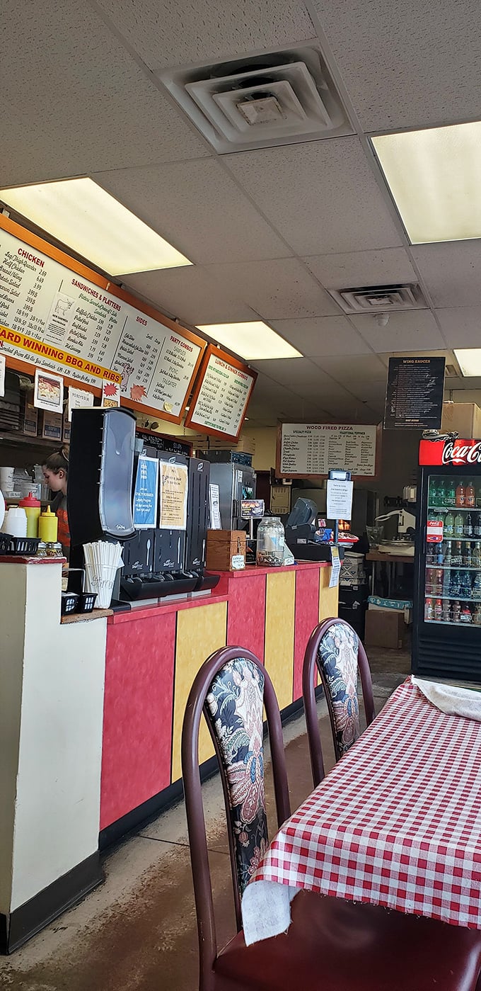 Red and yellow counter, checkered tablecloths—this place understands that BBQ is about comfort, not complexity. Just how it should be.
