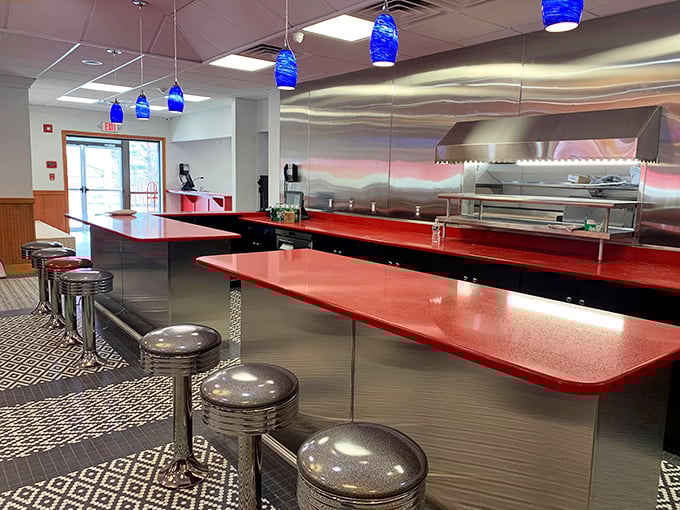 The counter seats—where solo diners become part of the Red Arrow family and the blue pendant lights cast a glow that makes everyone look like they're having the best day ever.