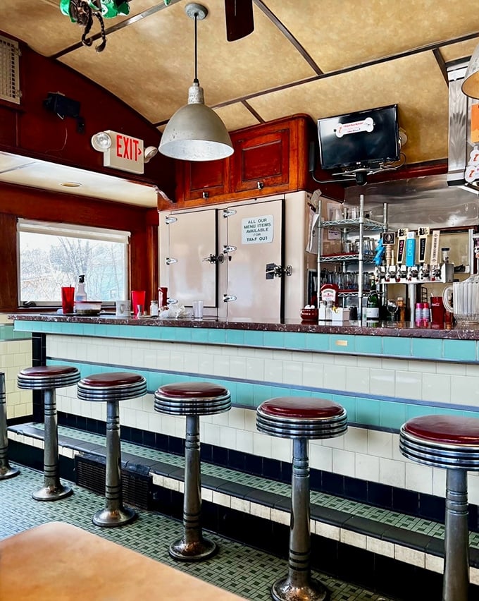 Classic counter seating in turquoise and chrome—where solo diners become part of the family and coffee cups are never empty.