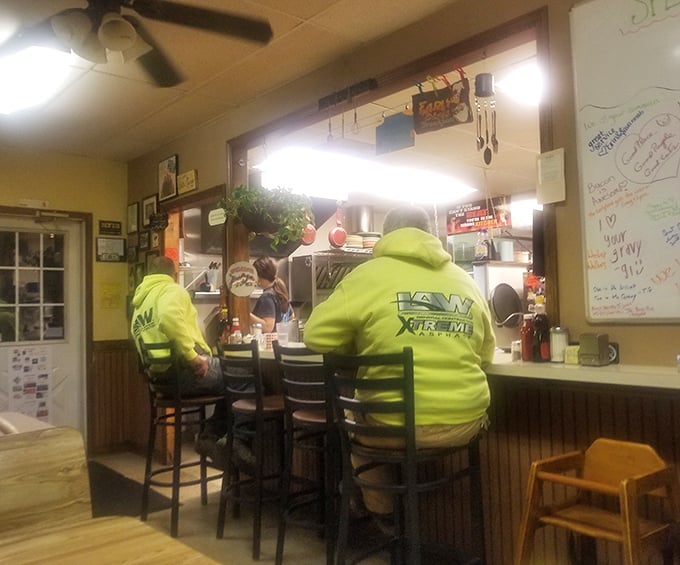 Counter seating offers a front-row view to the breakfast ballet—workers in high-vis gear fueling up before tackling the day ahead.