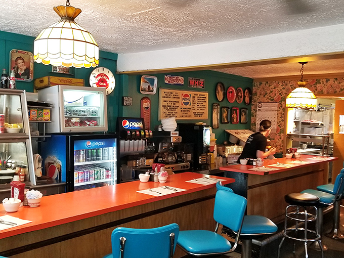 The beating heart of any great diner—a counter where regulars have their unofficial assigned seats and the coffee refills come without asking.