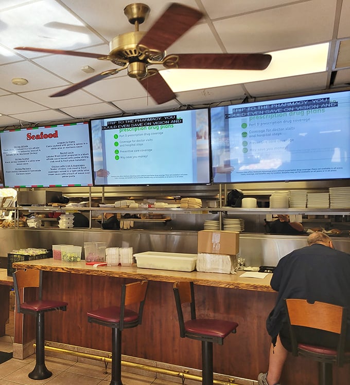 The counter seating offers front-row tickets to the culinary show, where kitchen symphonies play out in real-time.