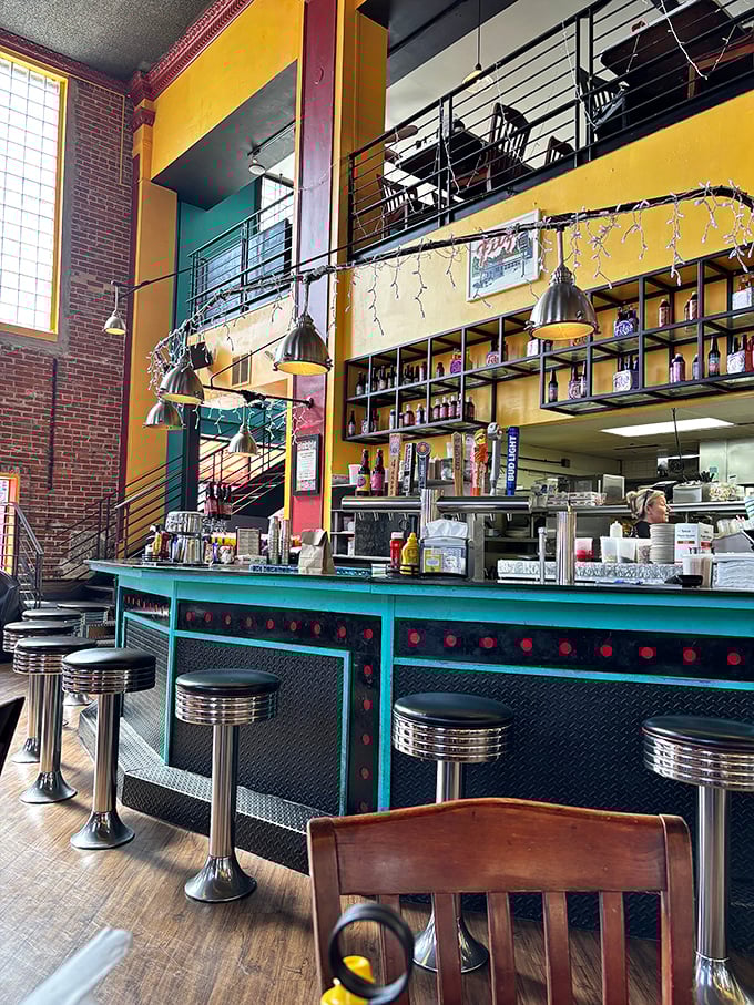 Classic diner counter meets modern brewery aesthetics—chrome stools invite you to perch and watch the culinary magic unfold.